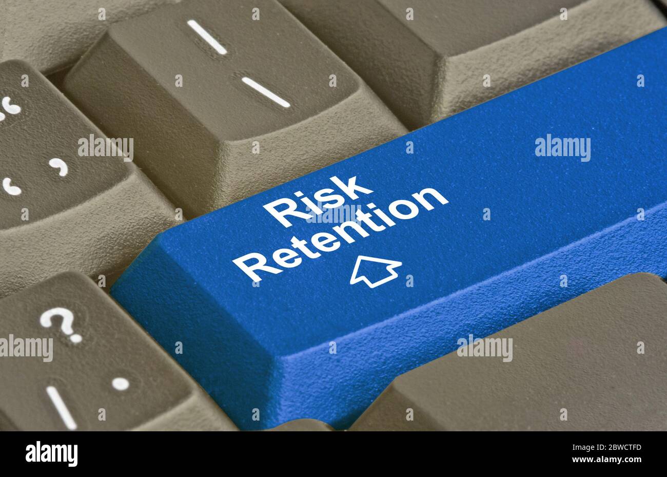Keyboard with key for risk retention Stock Photo - Alamy