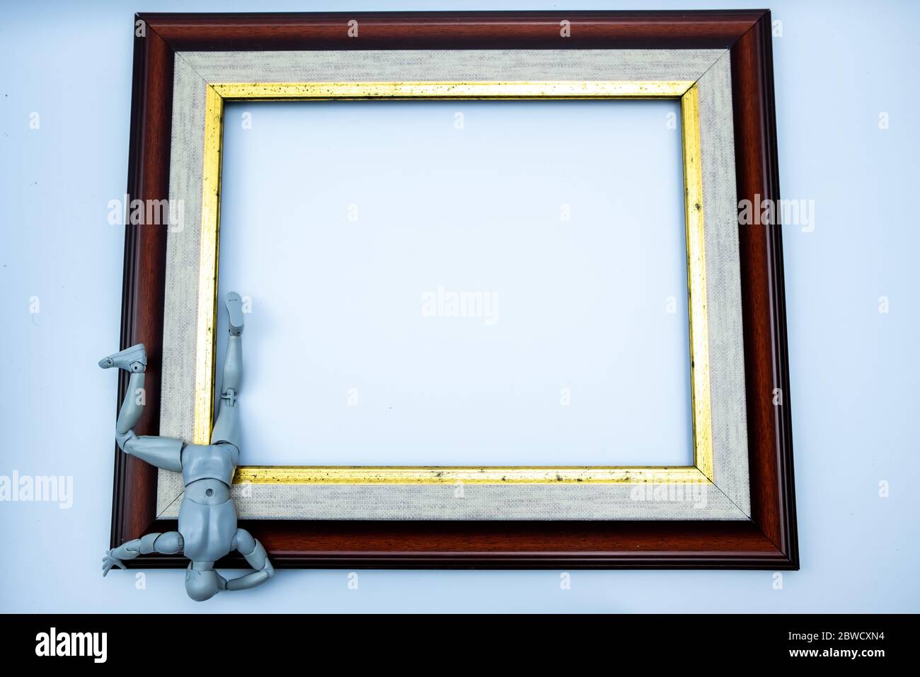 Mini figure try to escape from the frame, comfort zone concept on white ...