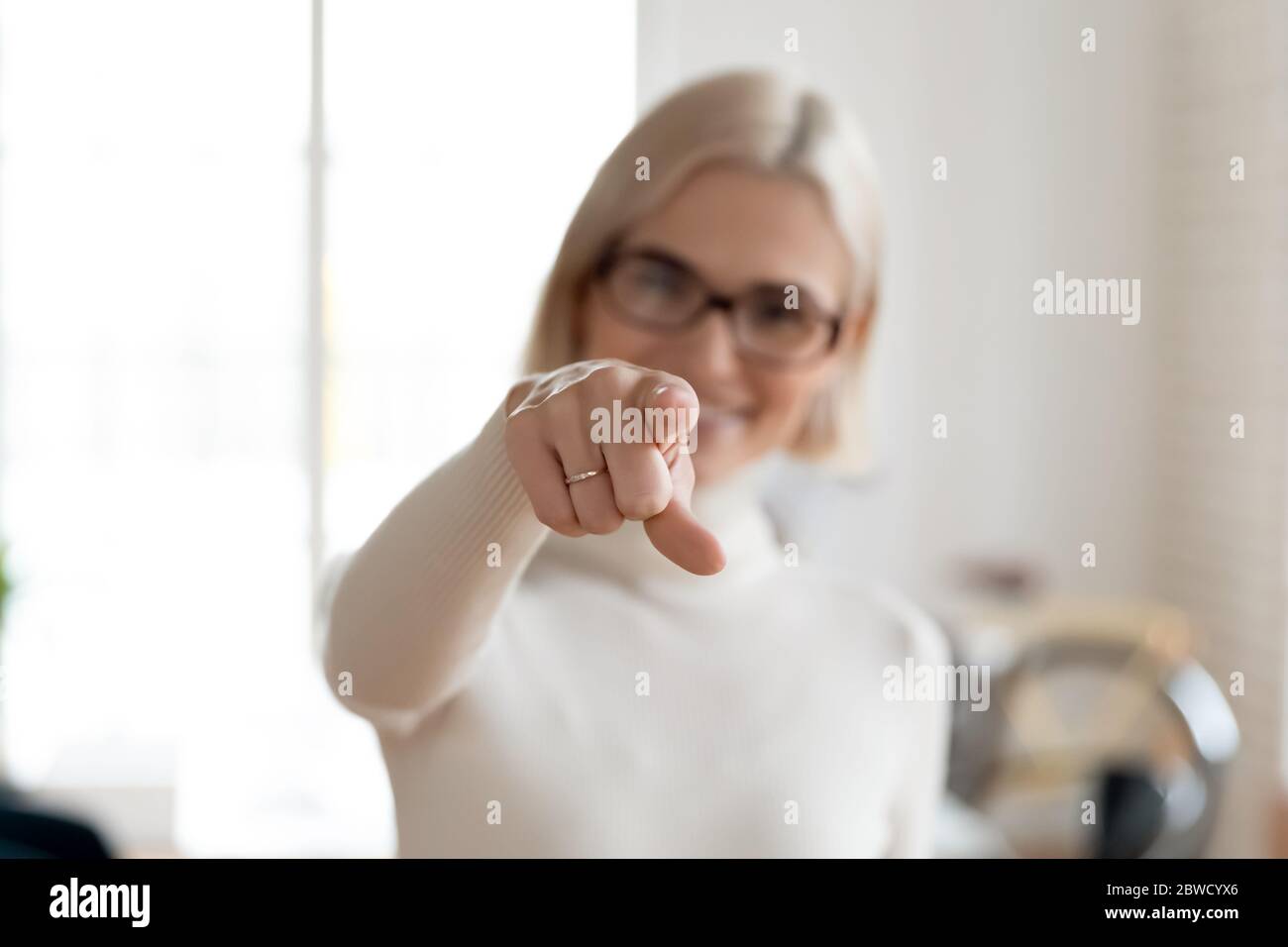 Smiling female hr manager pointing finger at camera Stock Photo - Alamy