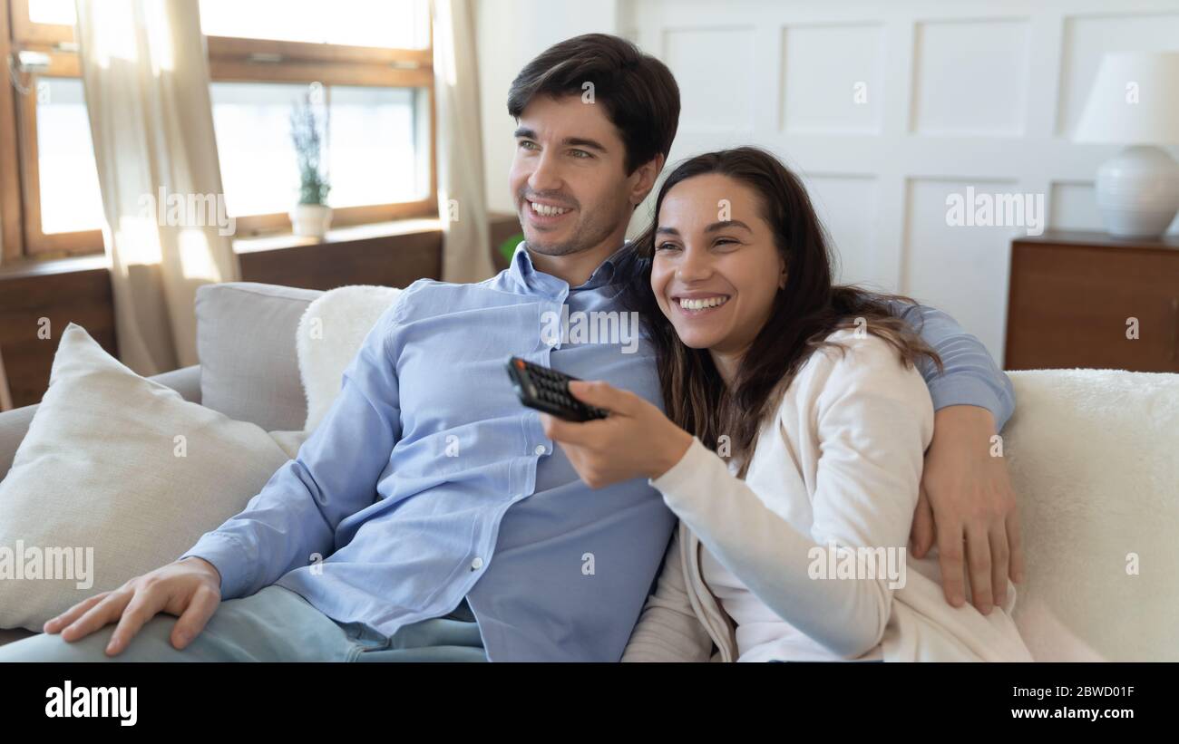 Couple couch tv hi-res stock photography and images - Alamy