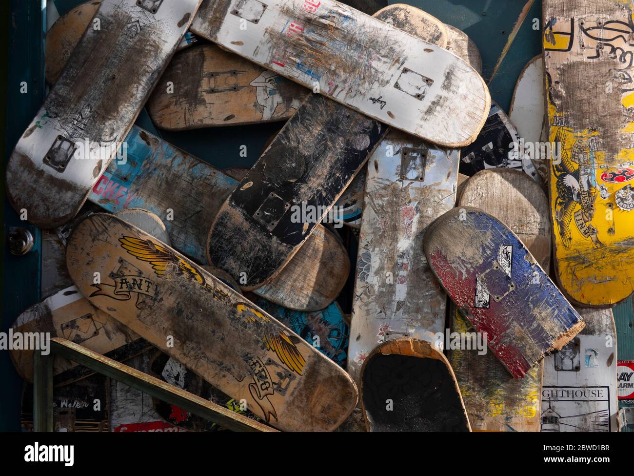old used skateboards collection on wall in Santa Barbara CA Stock Photo ...