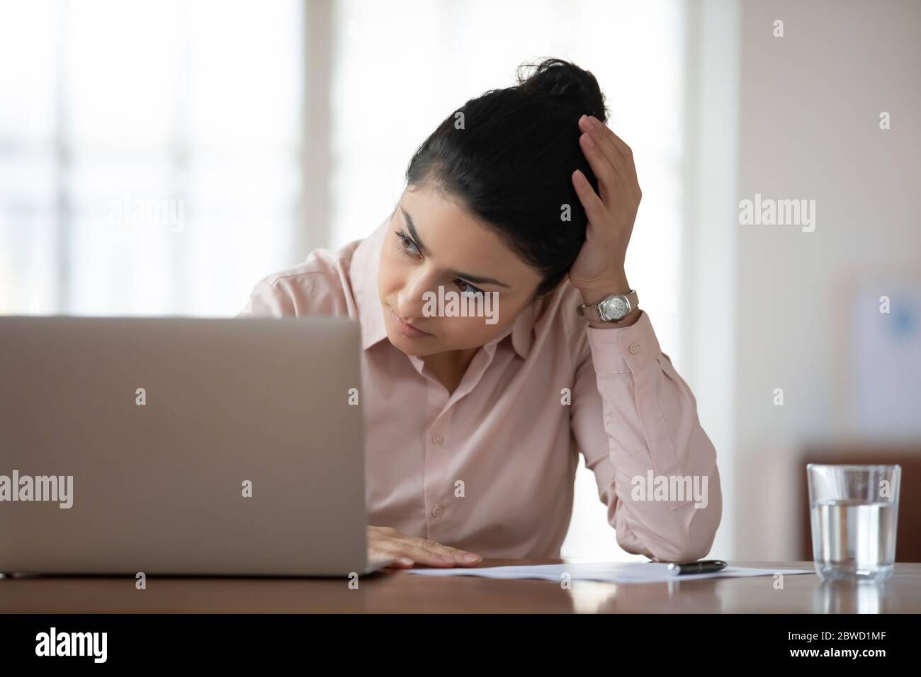Unhappy young female hindu employee feeling stressed at workplace Stock ...