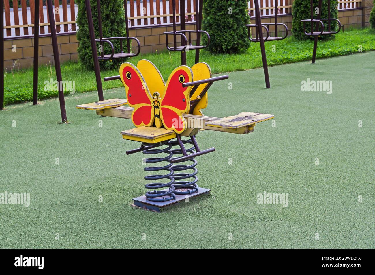 Dual childrens swing on twisted spring in form of the butterfly on ...