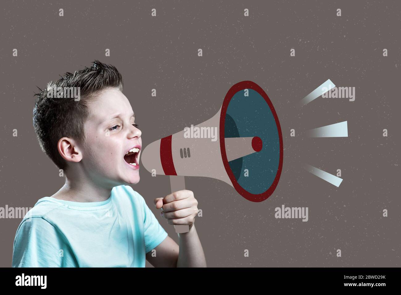 Boy shouting through vintage megaphone. Communication concept Stock ...