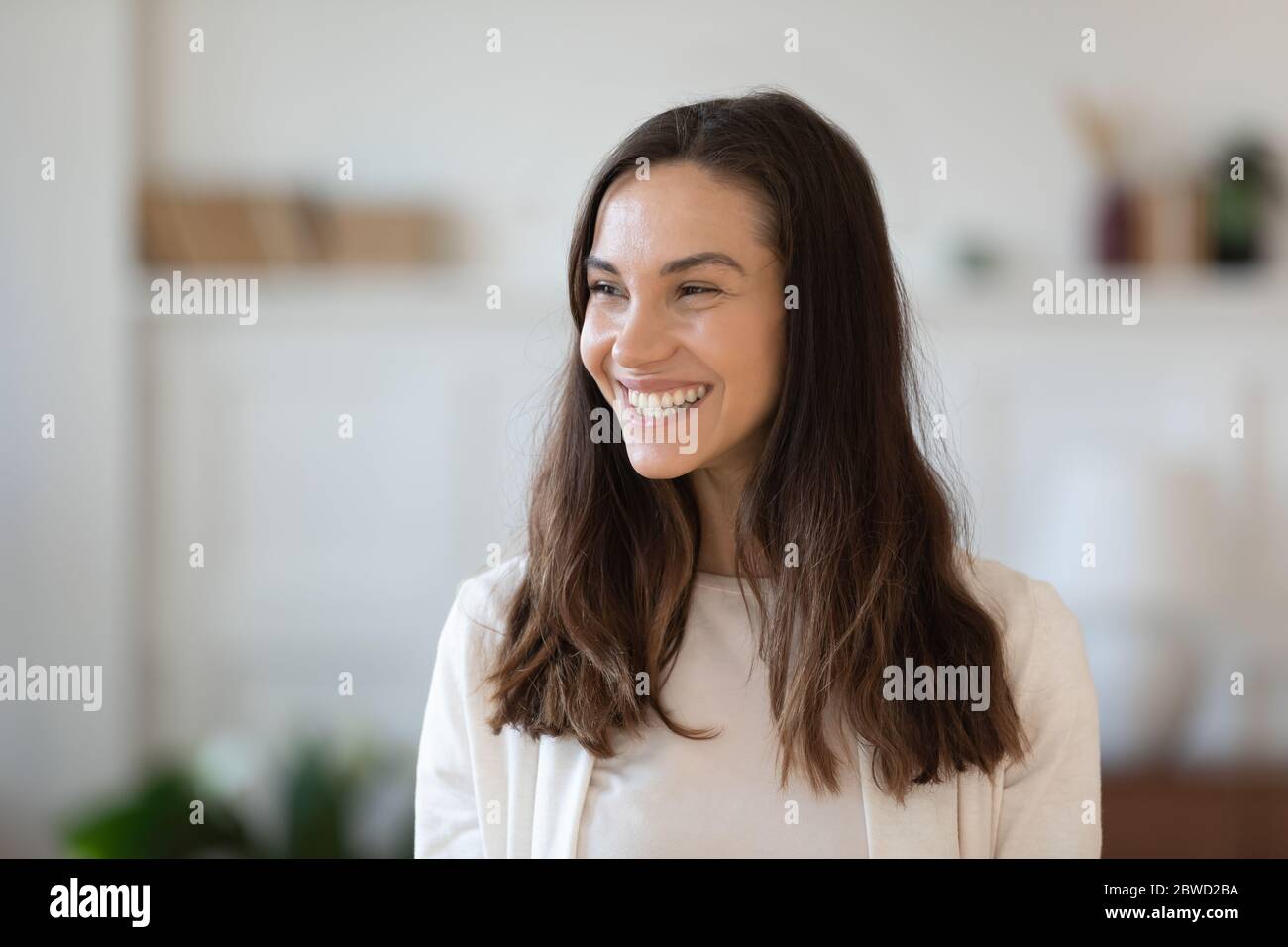 Smiling young woman look in distance visualizing Stock Photo - Alamy