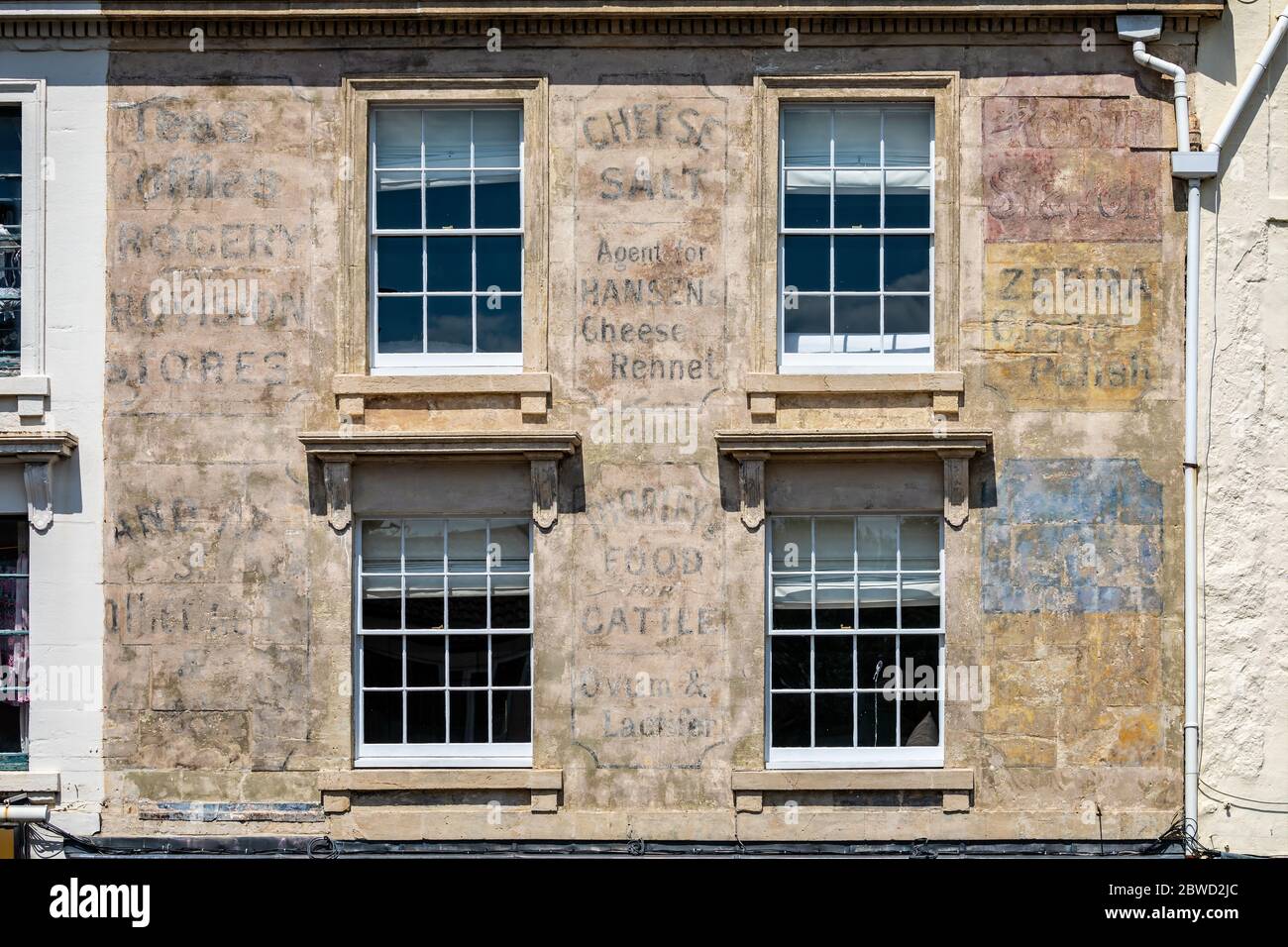 Vintage faded retail advertising signs from the early 1900's painted on ...