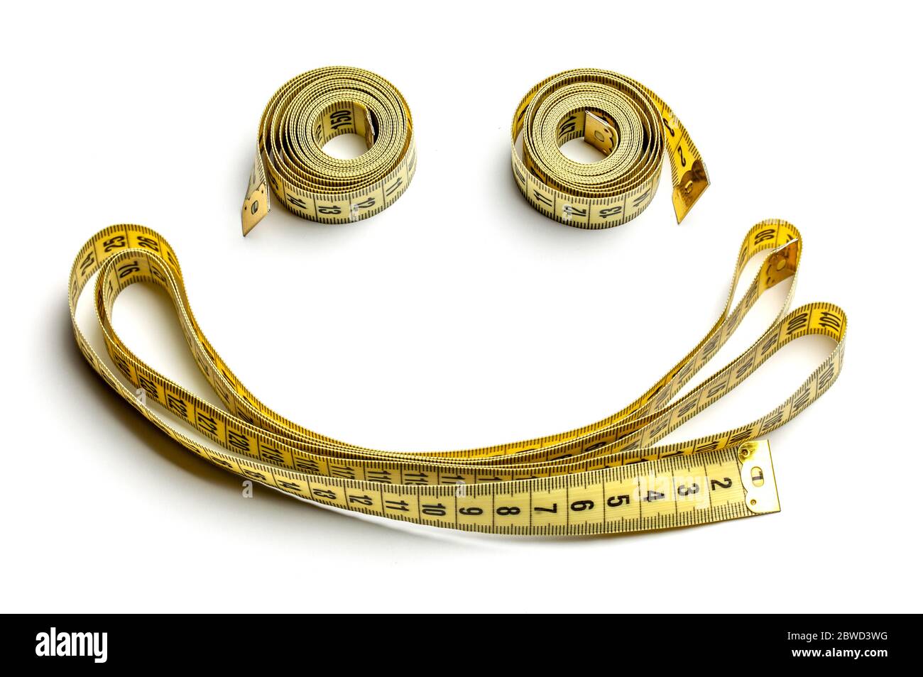 Smile from a yellow measuring tape isolated on a white background Stock ...