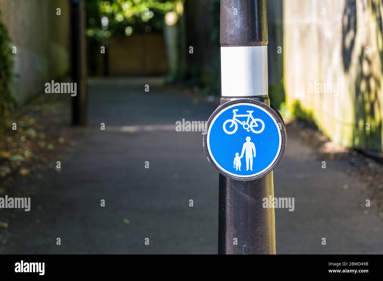 Shared path for bike (bicycle) and pedestrians sign board on bollard at ...