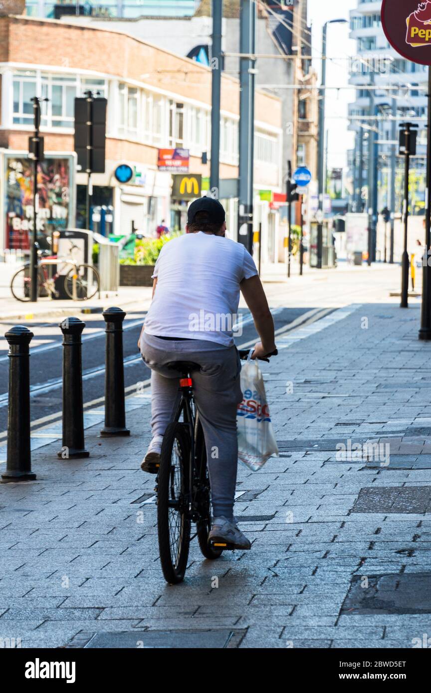 Heavy adult riding bicycle hi-res stock photography and images - Alamy