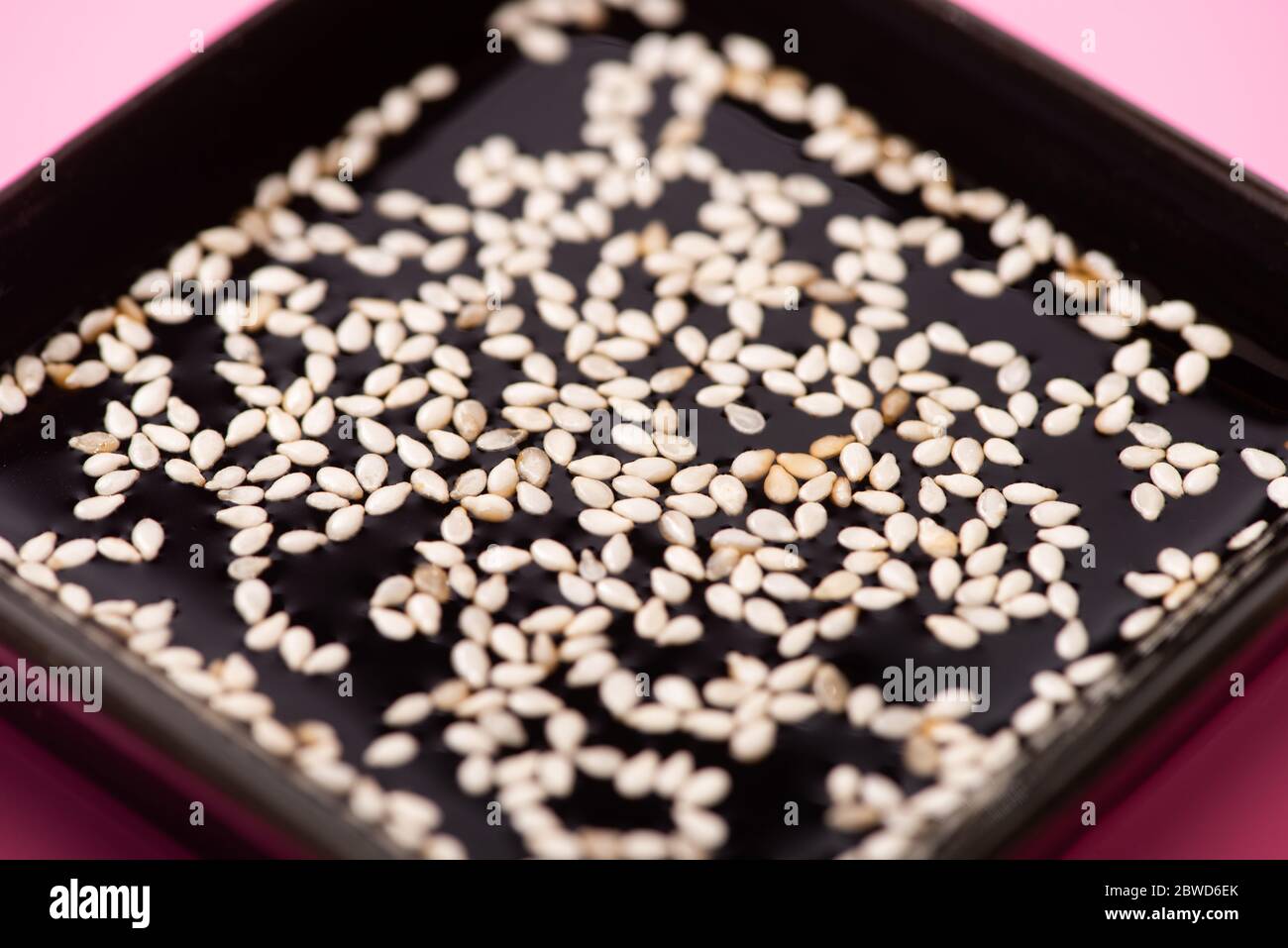 close up of soy sauce with sesame in bowl Stock Photo - Alamy