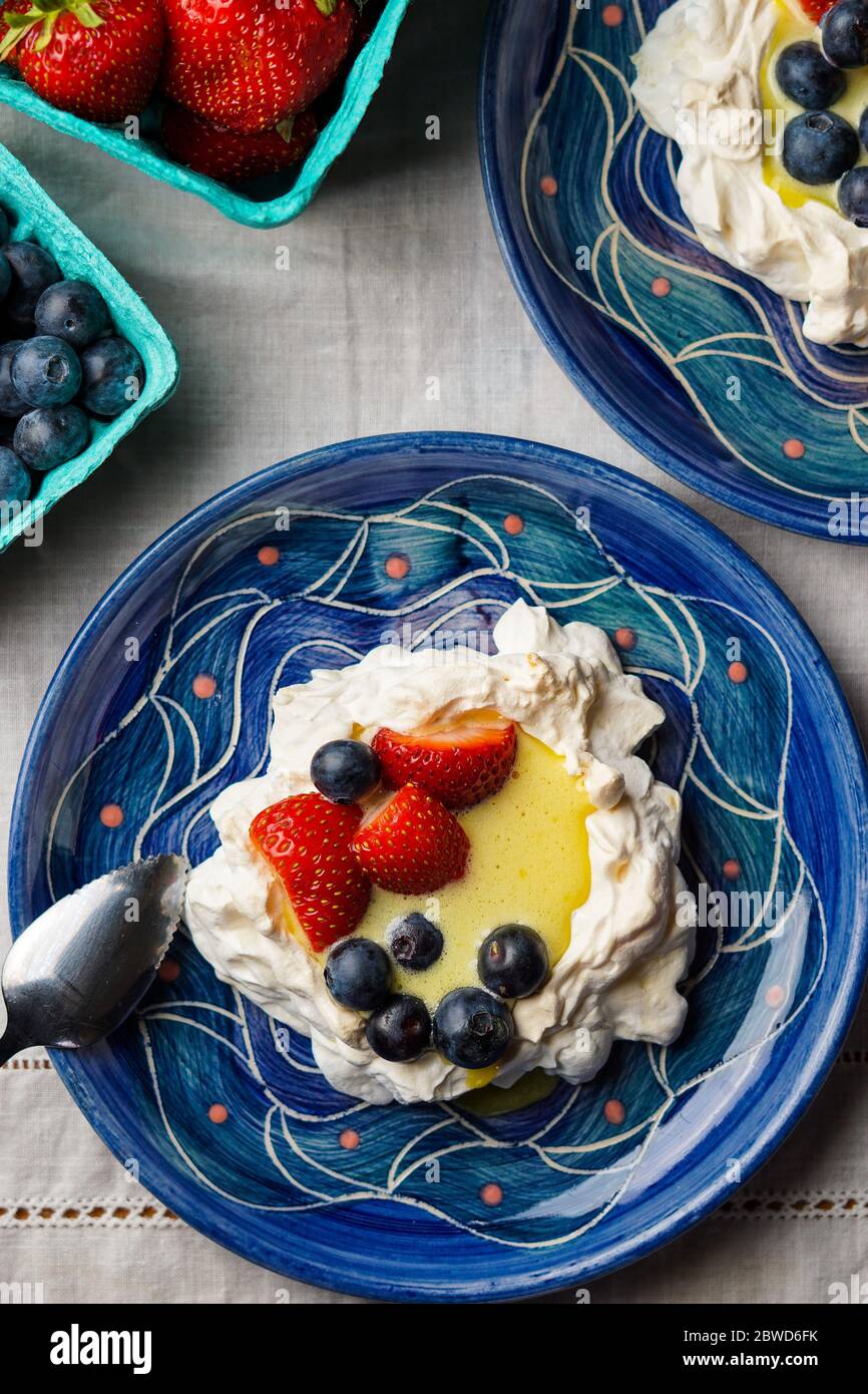 Meringue with lemon curd and berries hi-res stock photography and ...