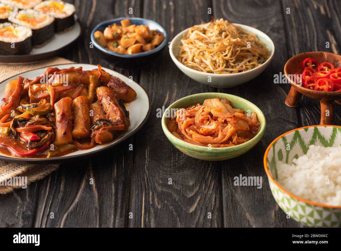 selective focus of traditional topokki near tasty korean dishes on ...