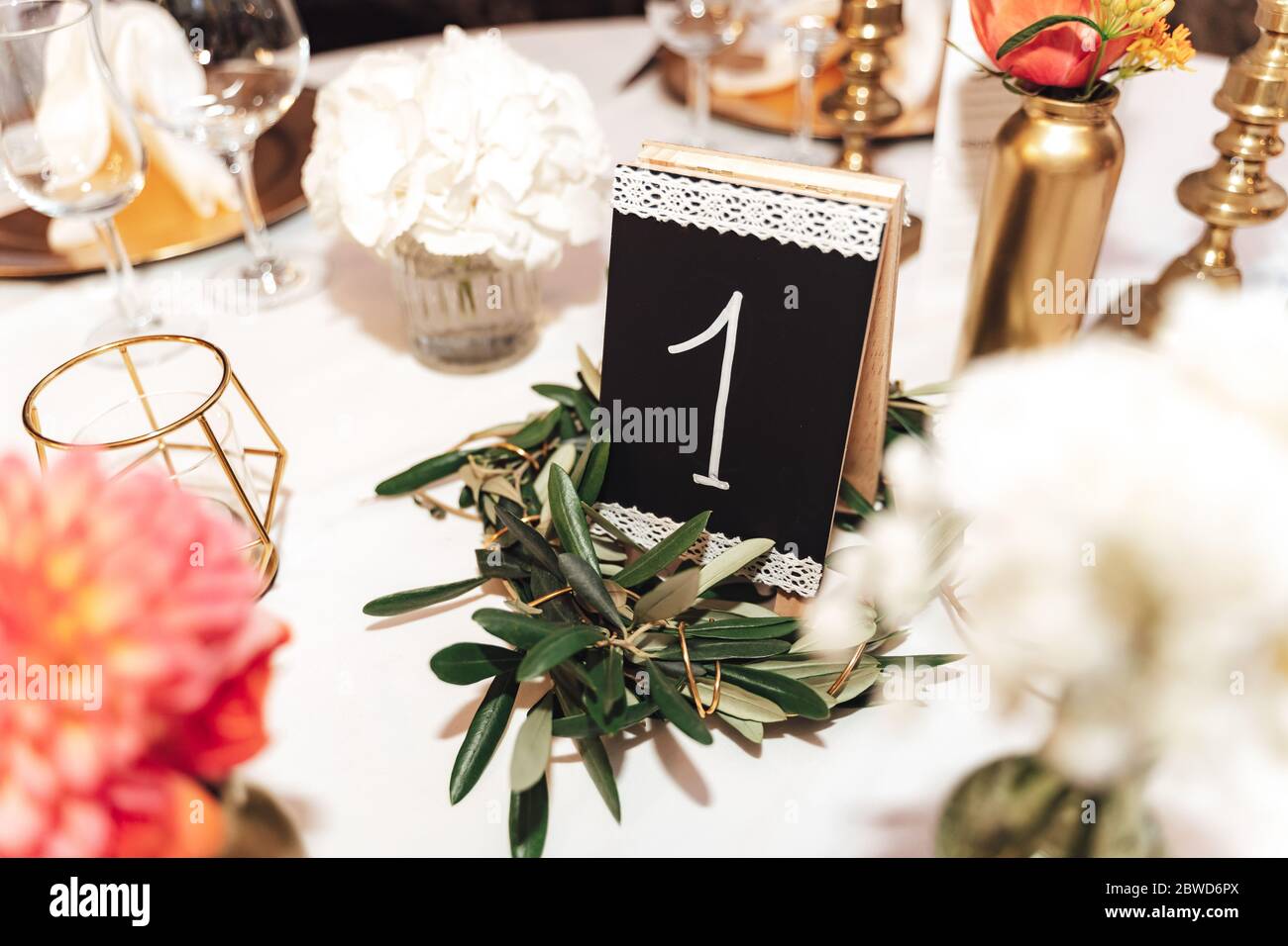 Festive table decoration. Close up of standing number of table and ...