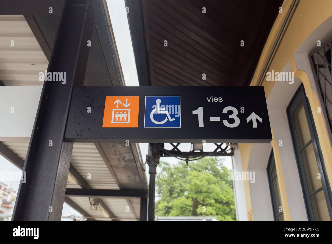 Signs and symbols on nameplate of train station in Catalonia, Spain ...