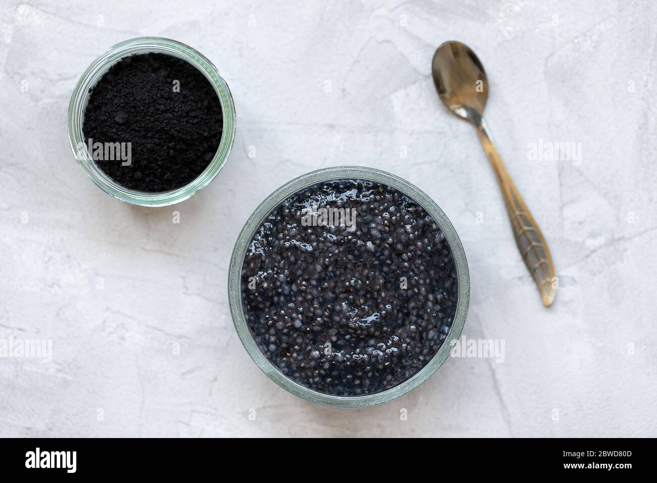Black chia pudding with activated charcoal powder Stock Photo - Alamy