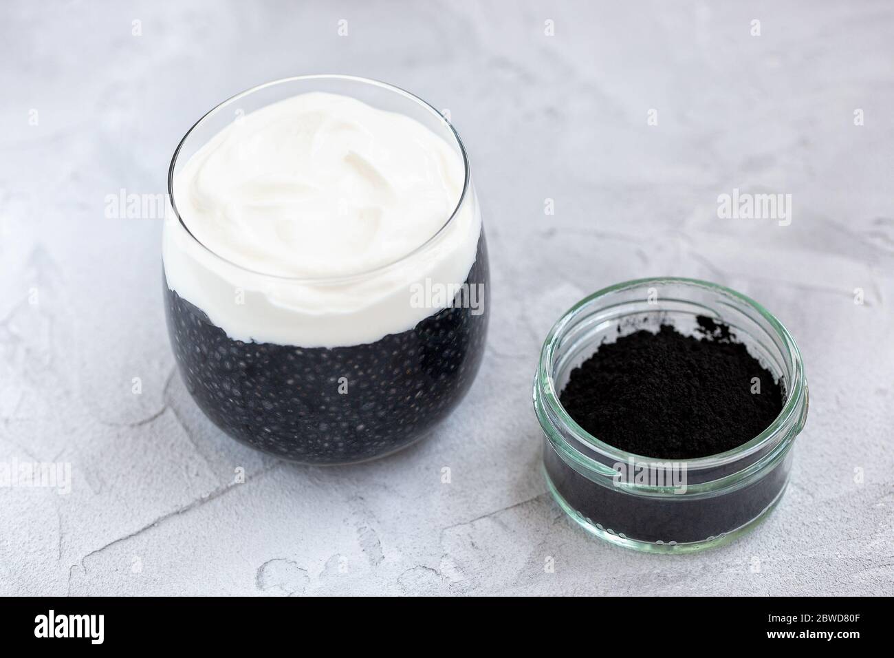 Black chia pudding with activated charcoal powder Stock Photo - Alamy