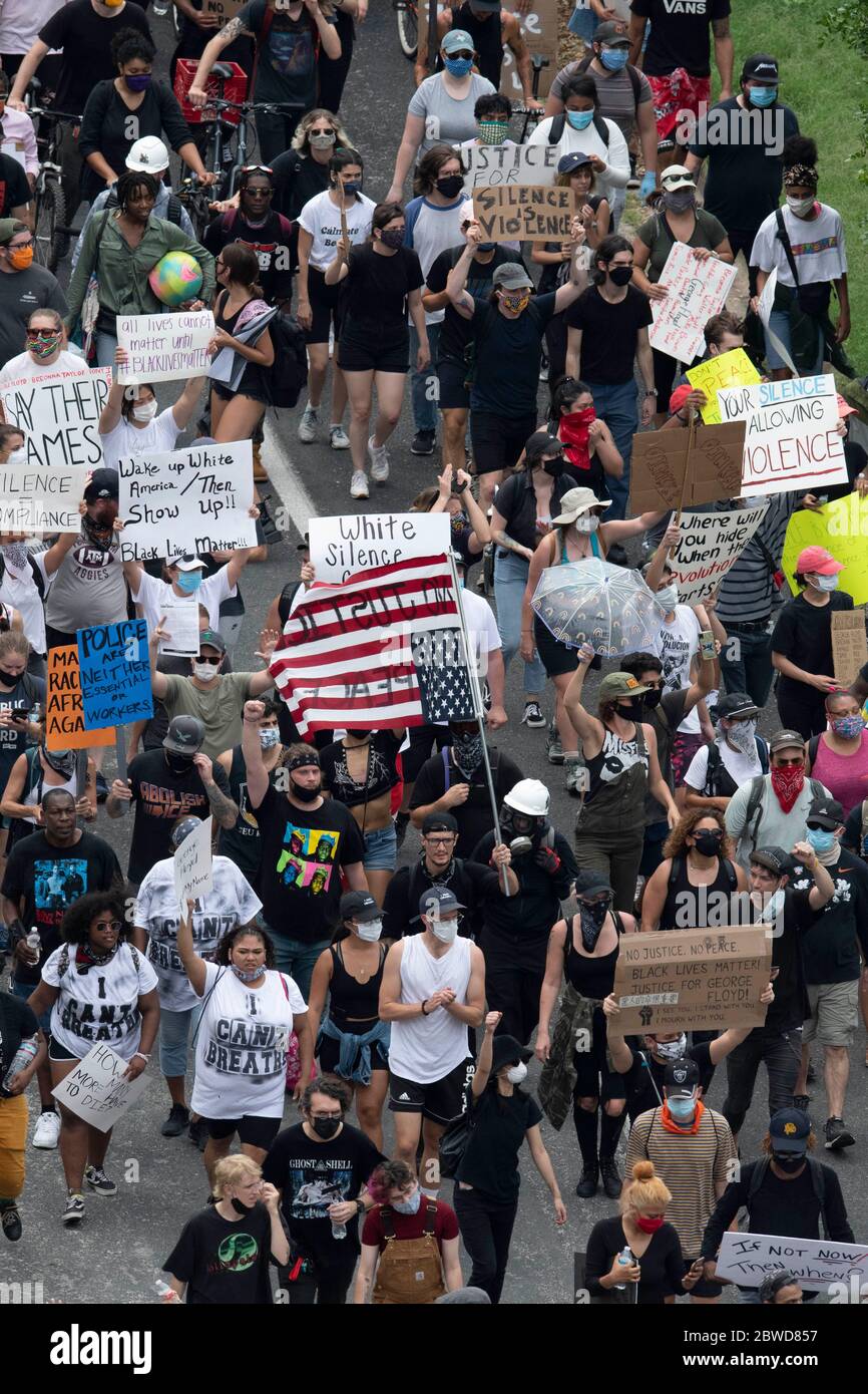 Austin, Texas, USA. 31st May, 2020. Protesters march down 12th Street ...