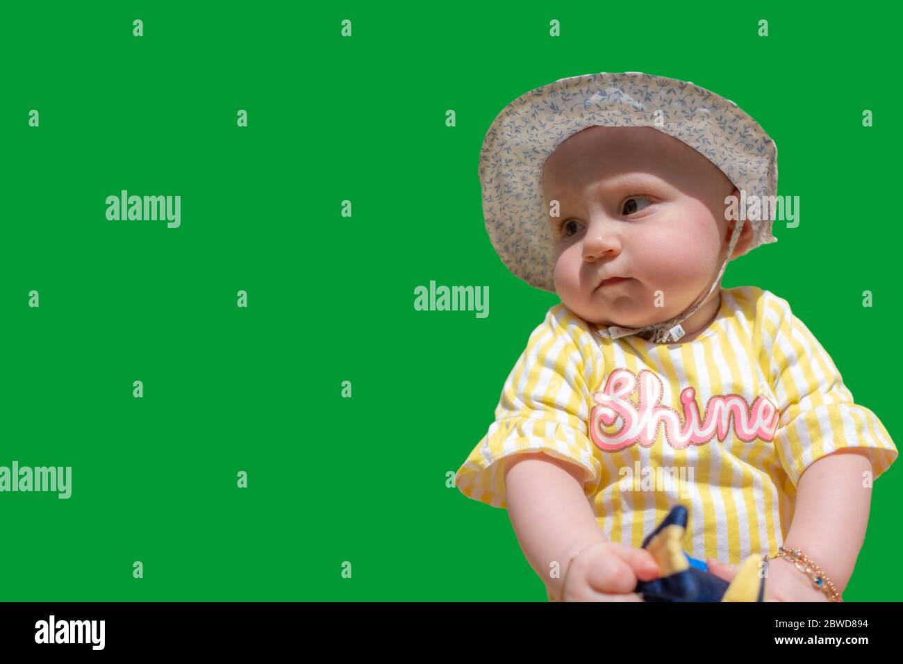 Cute baby girl wear adorable hat looking at camera make funny faces on ...