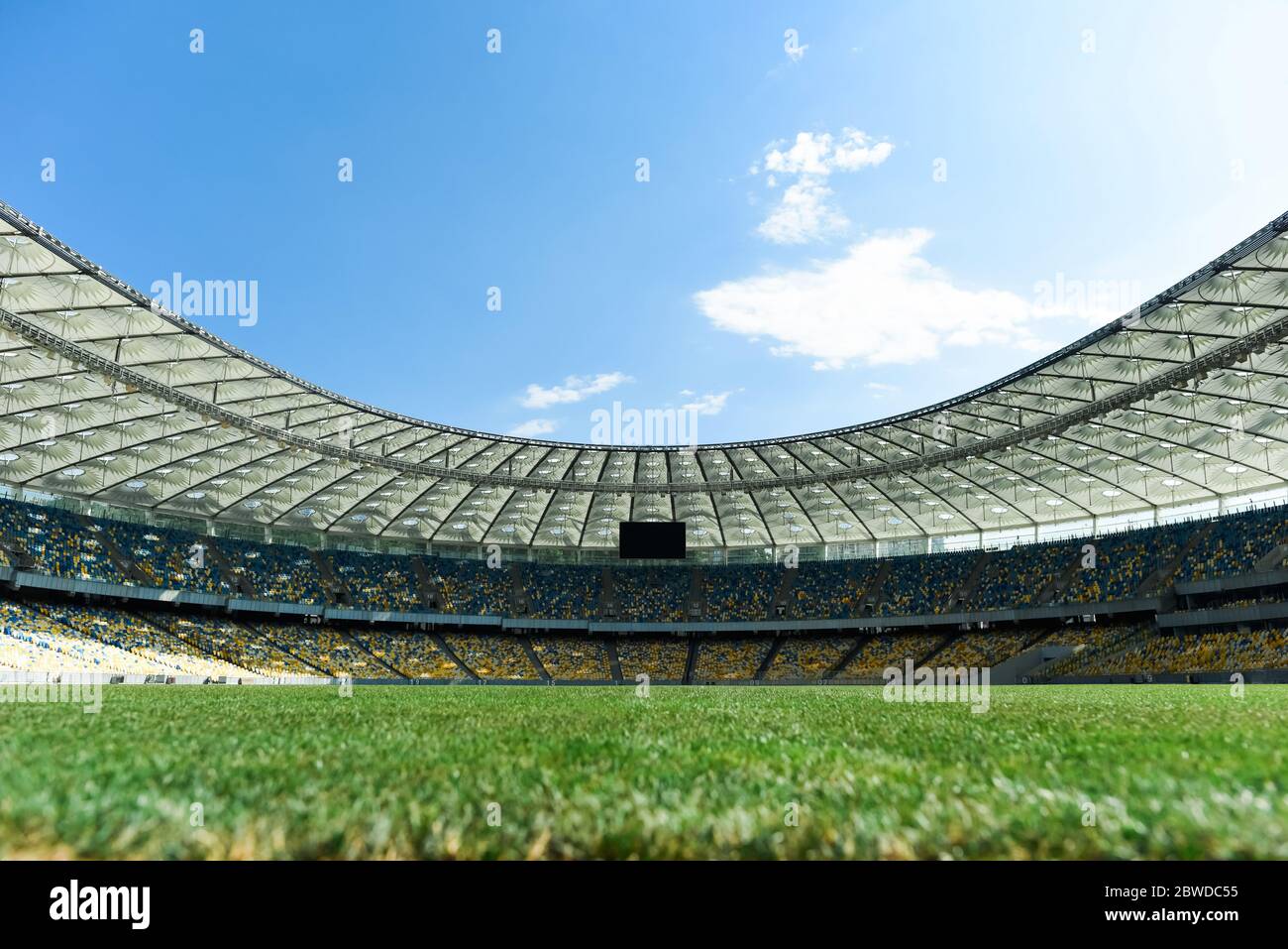 grassy football pitch at stadium at sunny day with blue sky Stock Photo ...