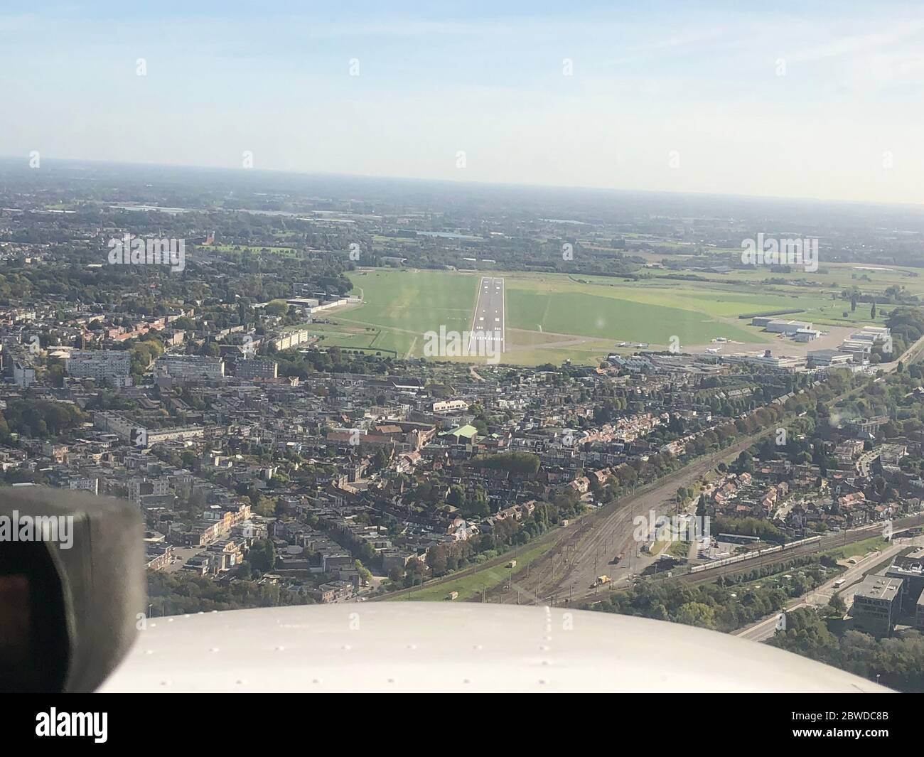 Approaching a runway strip with a propeller plane Stock Photo - Alamy