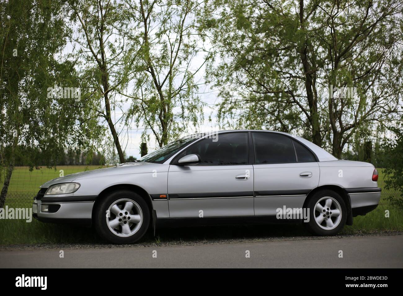 Gray sedan car Opel Omega on the road Stock Photo - Alamy