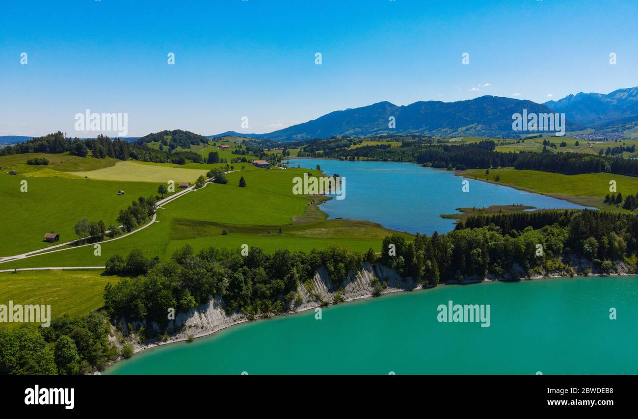 Aerial view over Lake Forggensee at the city of Fuessen in Germany ...