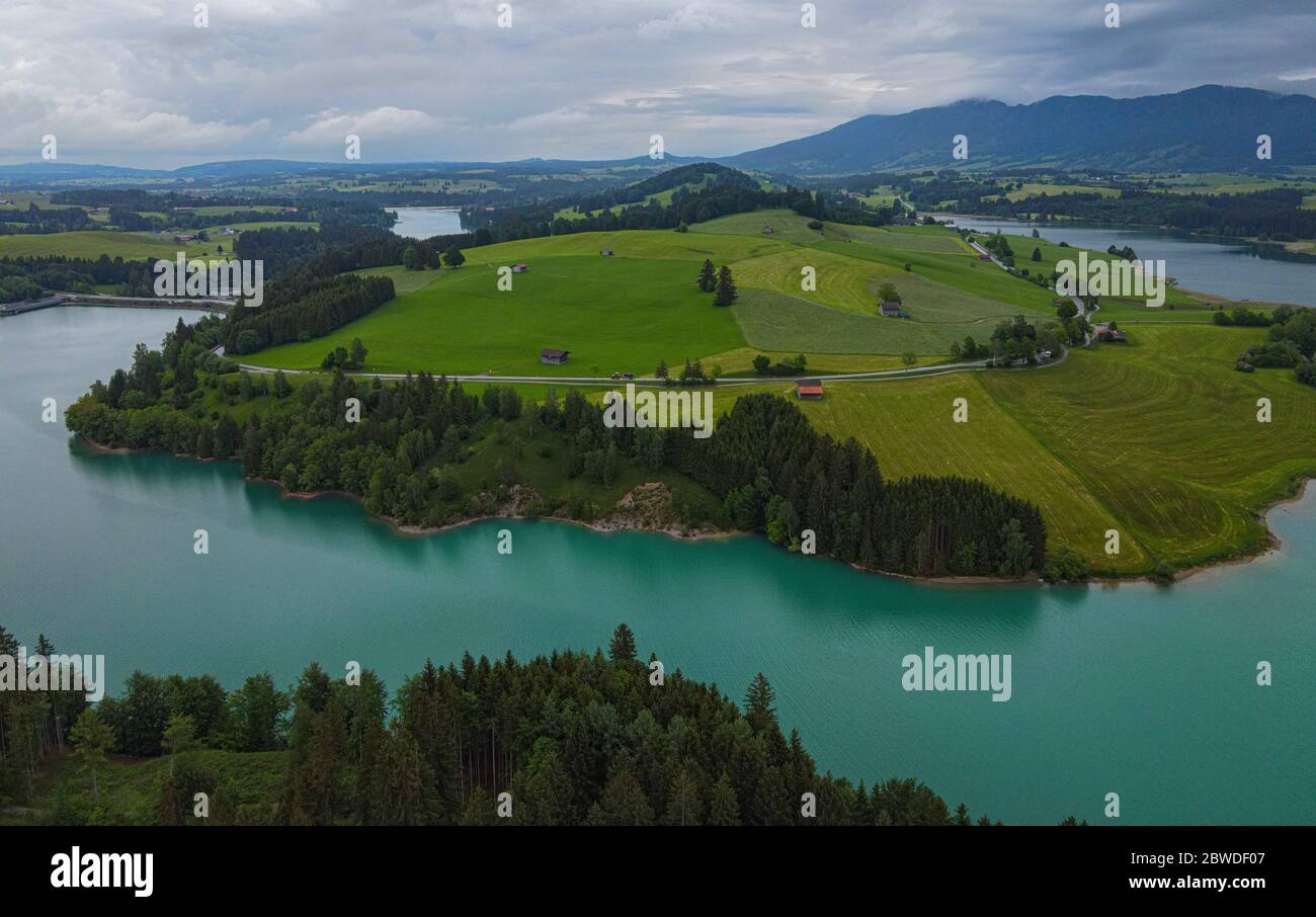 Aerial view over Lake Forggensee at the city of Fuessen in Germany ...