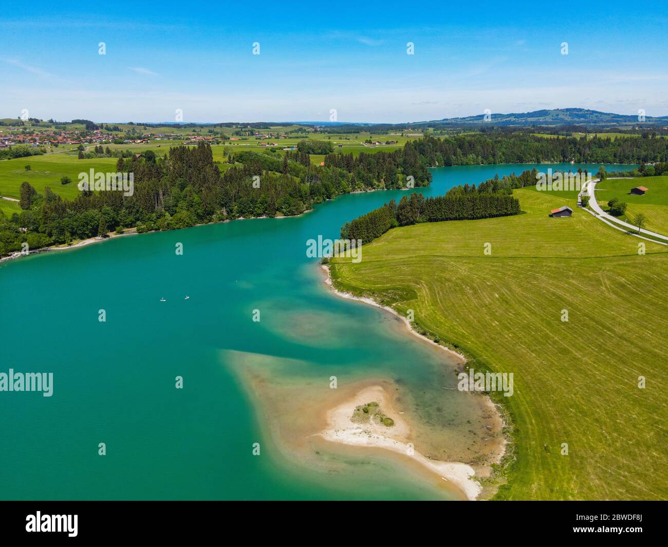 Aerial view over Lake Forggensee at the city of Fuessen in Germany ...