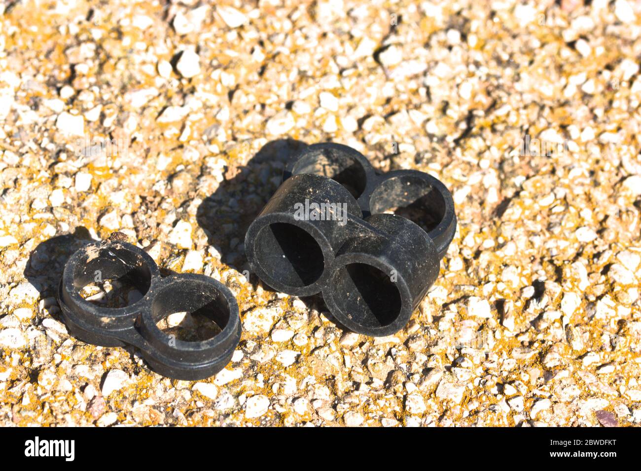 Detail of some black double ring plugs that serve to close the rubbers ...