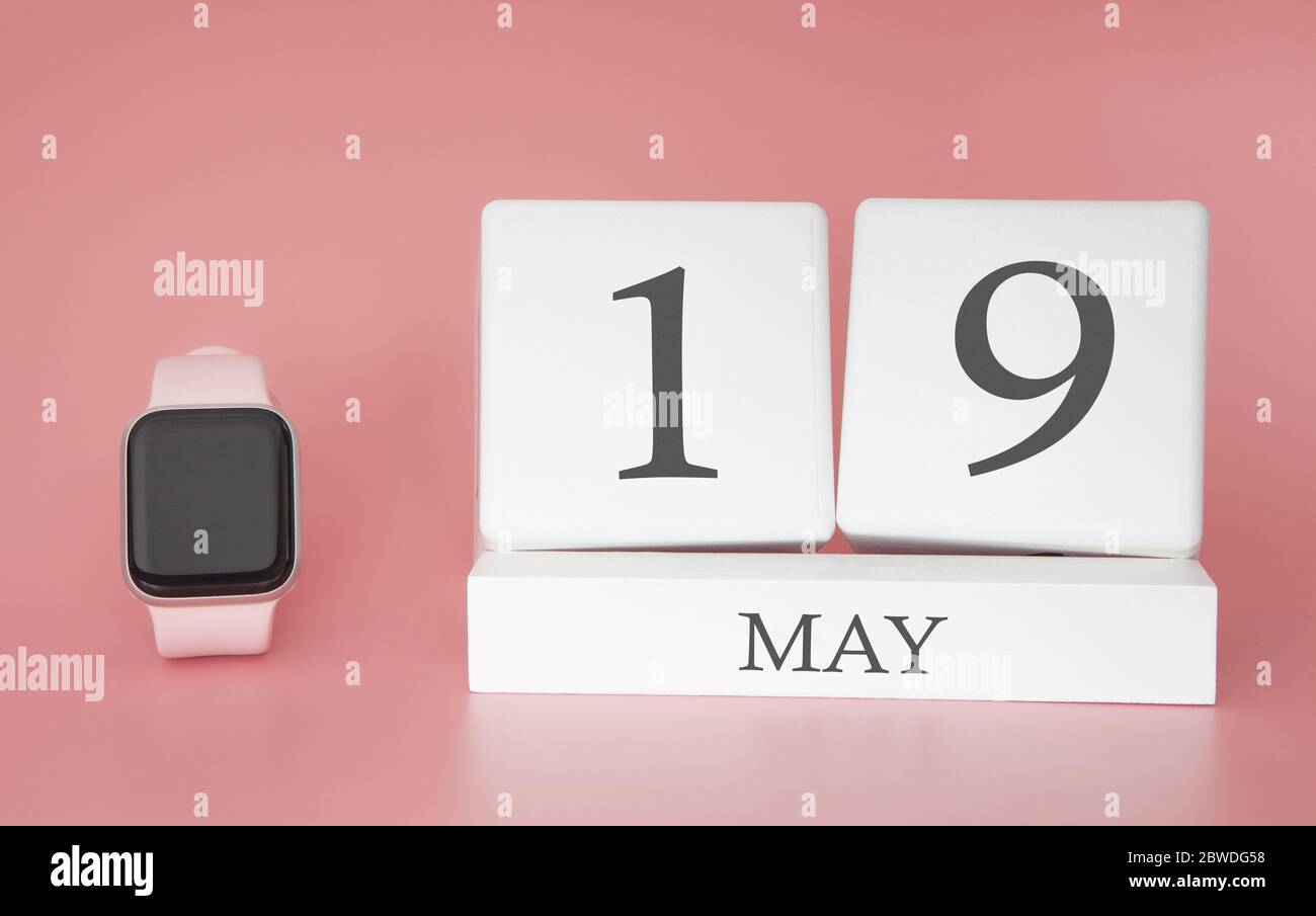 Modern Watch with cube calendar and date 19 may on pink background ...