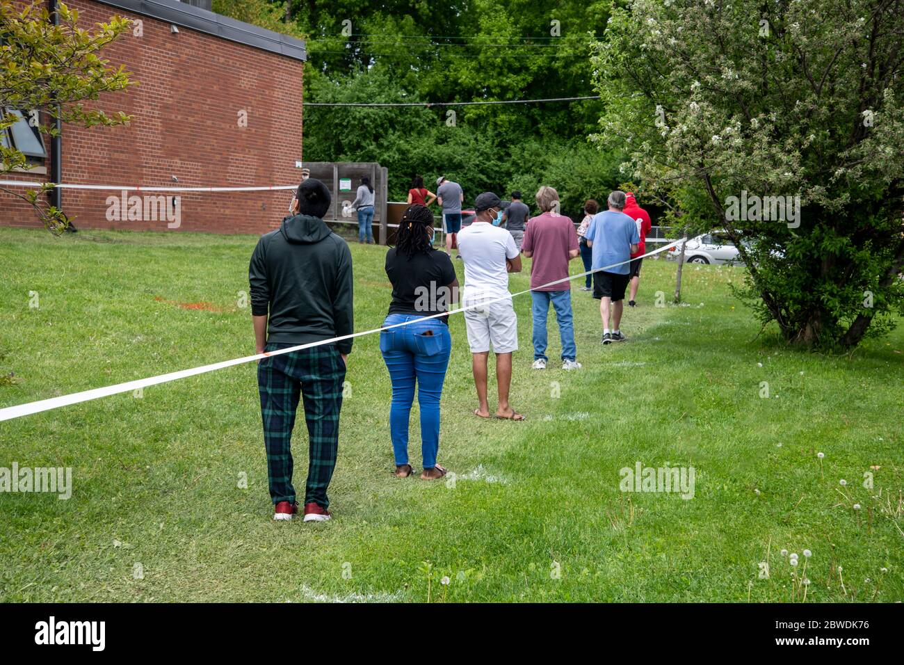 St. Paul, Minnesota. People stand in line at the National Guard armory ...