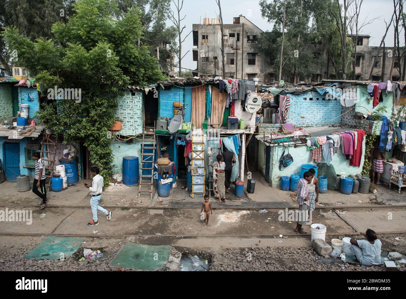 Crowded slums alongside the train tracks. New Delhi, India. India ...