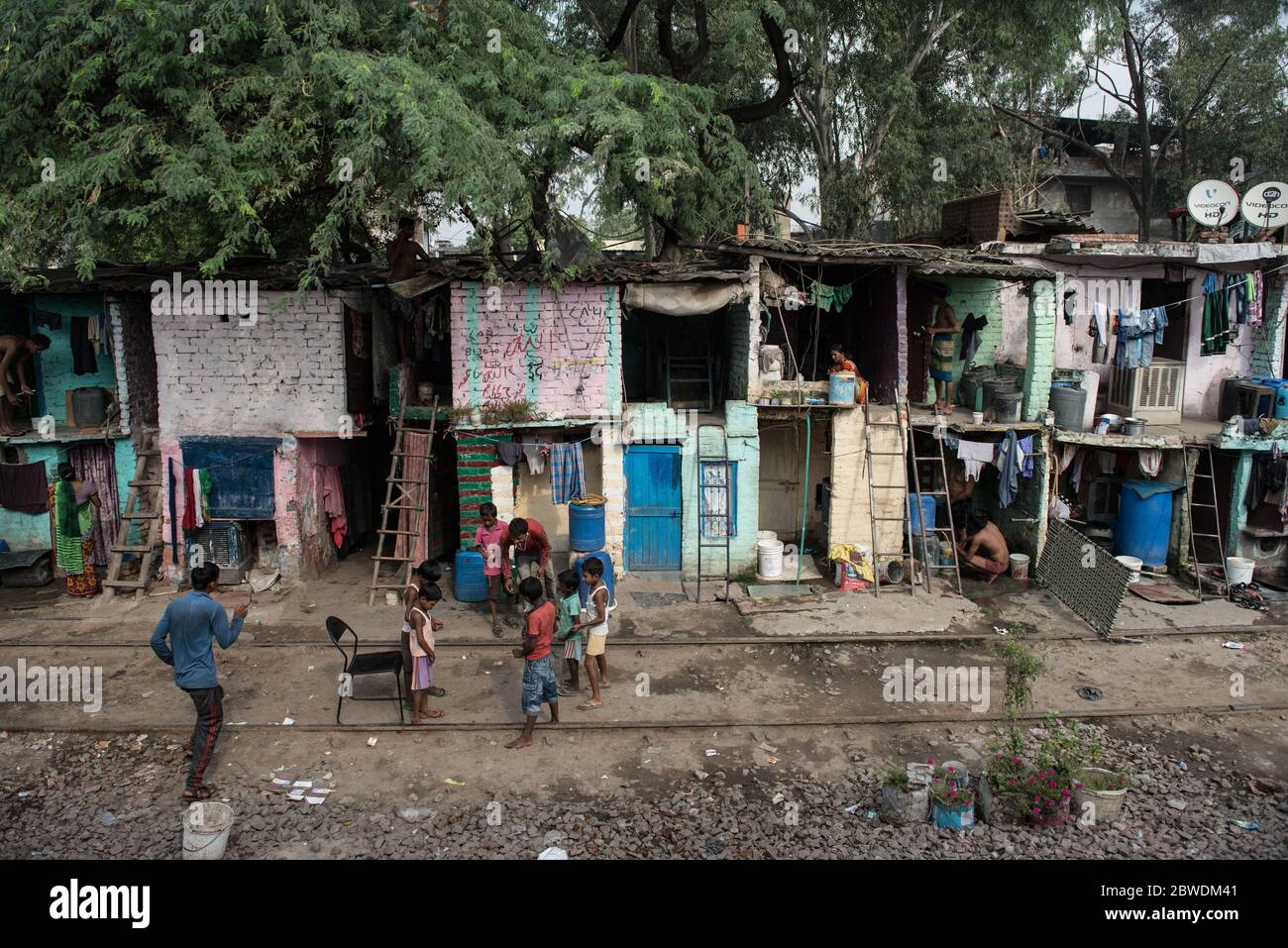 Crowded slums alongside the train tracks. New Delhi, India. India ...