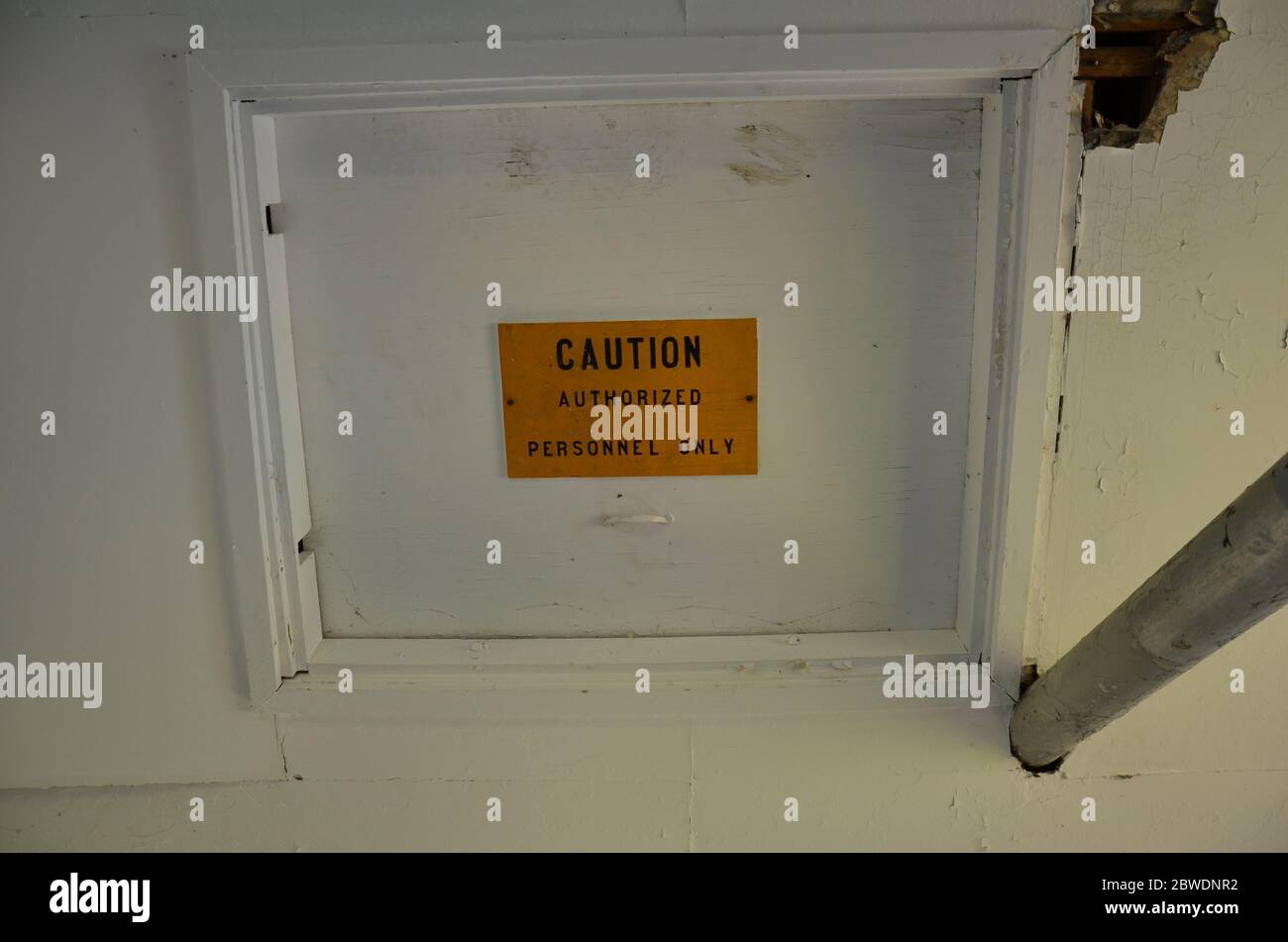 caution authorized personnel only sign on attic entrance on ceiling ...