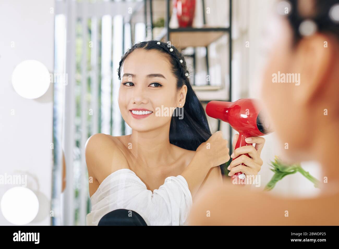 Woman drying hair fan hi-res stock photography and images - Alamy