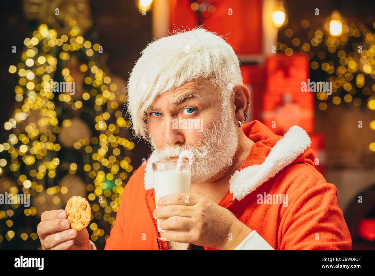 Santa Claus takes a cookie on Christmas Eve as a thank you gift for ...