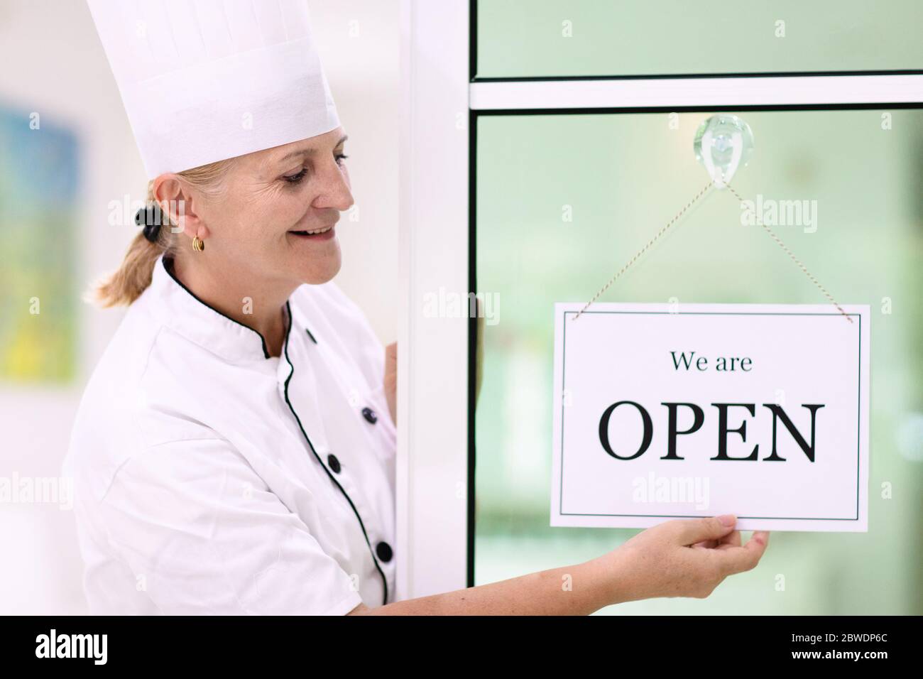 Cafe opening after lockdown. Open sign on front door of restaurant or ...