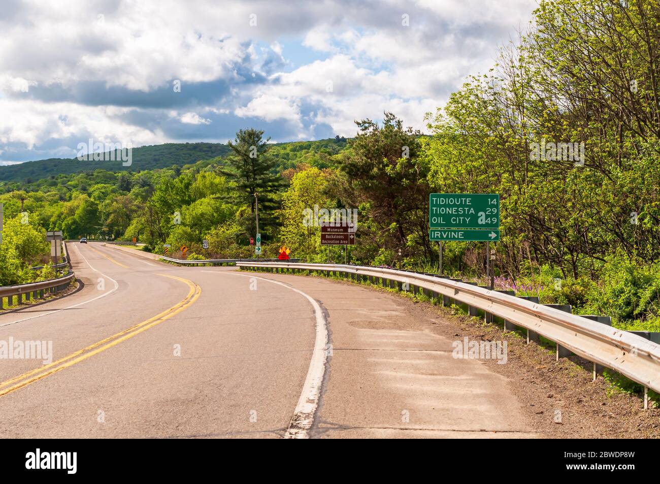 Road signs along US route 62 on a sunny spring day, Warren County ...