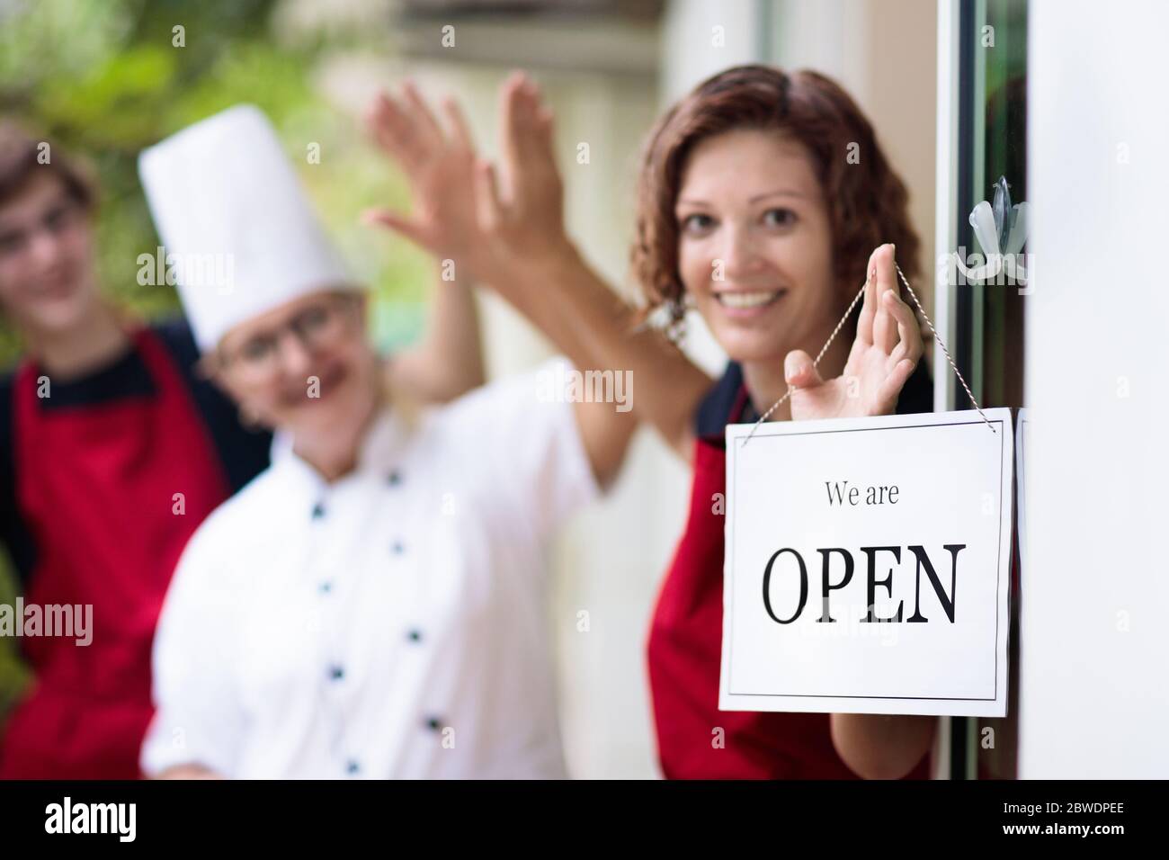 Cafe opening after lockdown. Open sign on front door of restaurant or ...
