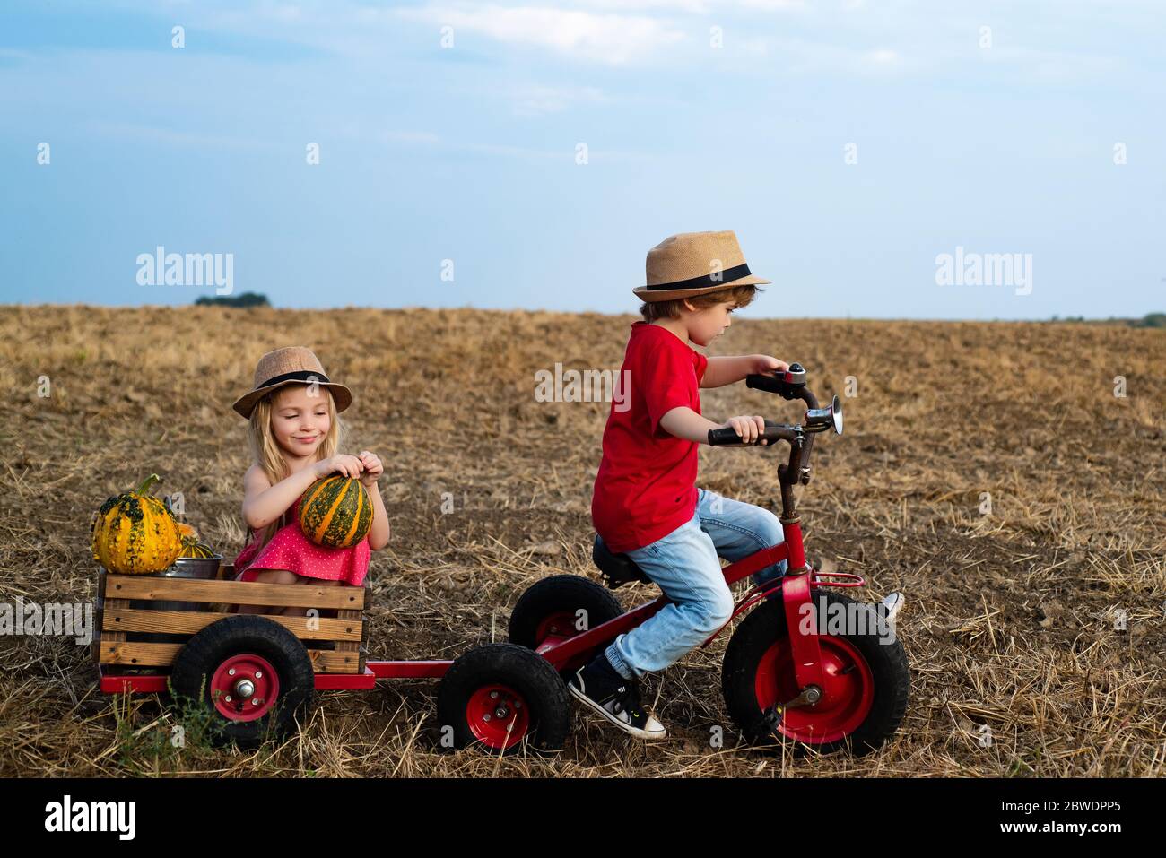 Funny people. Happy children farmers having fun on spring field ...