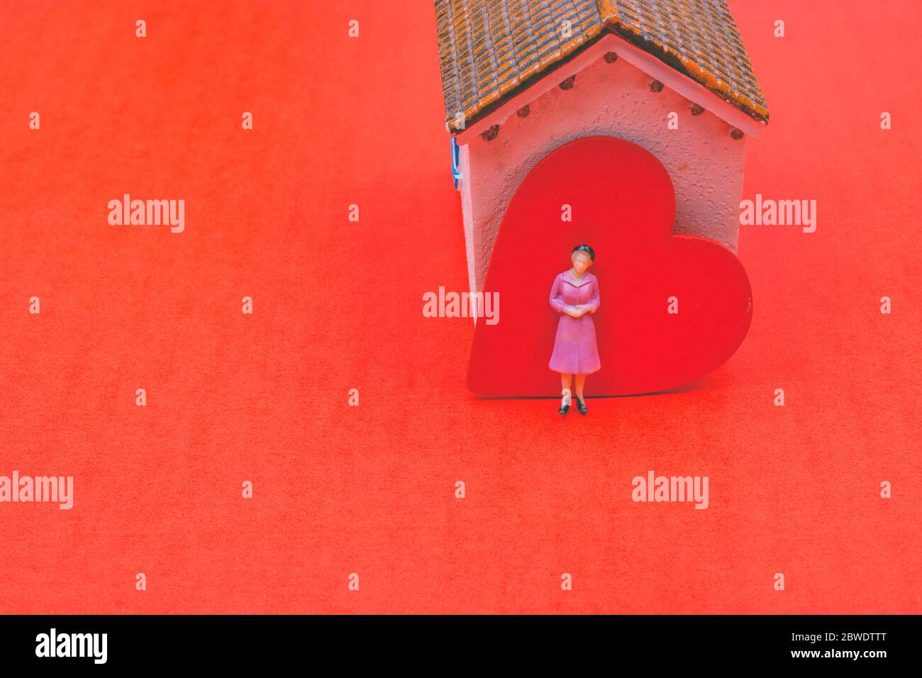 Home with love symbol and woman figurine . Happy family, real estate ...