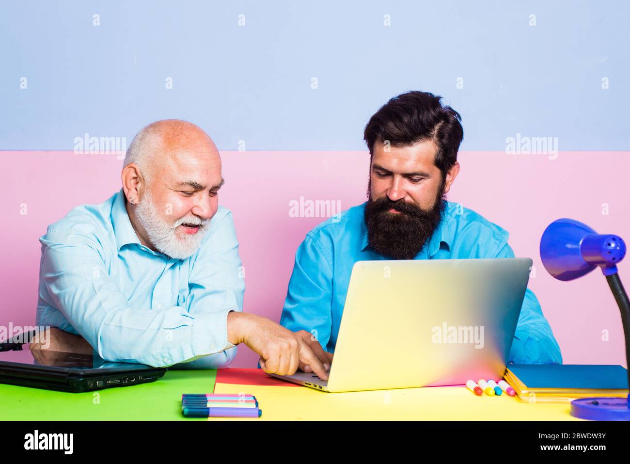 Businessman wearing shirt working with laptop at table. Business men ...