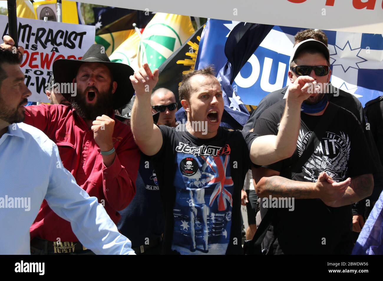 Key activists of Australian patriot groups lead the front of the march ...