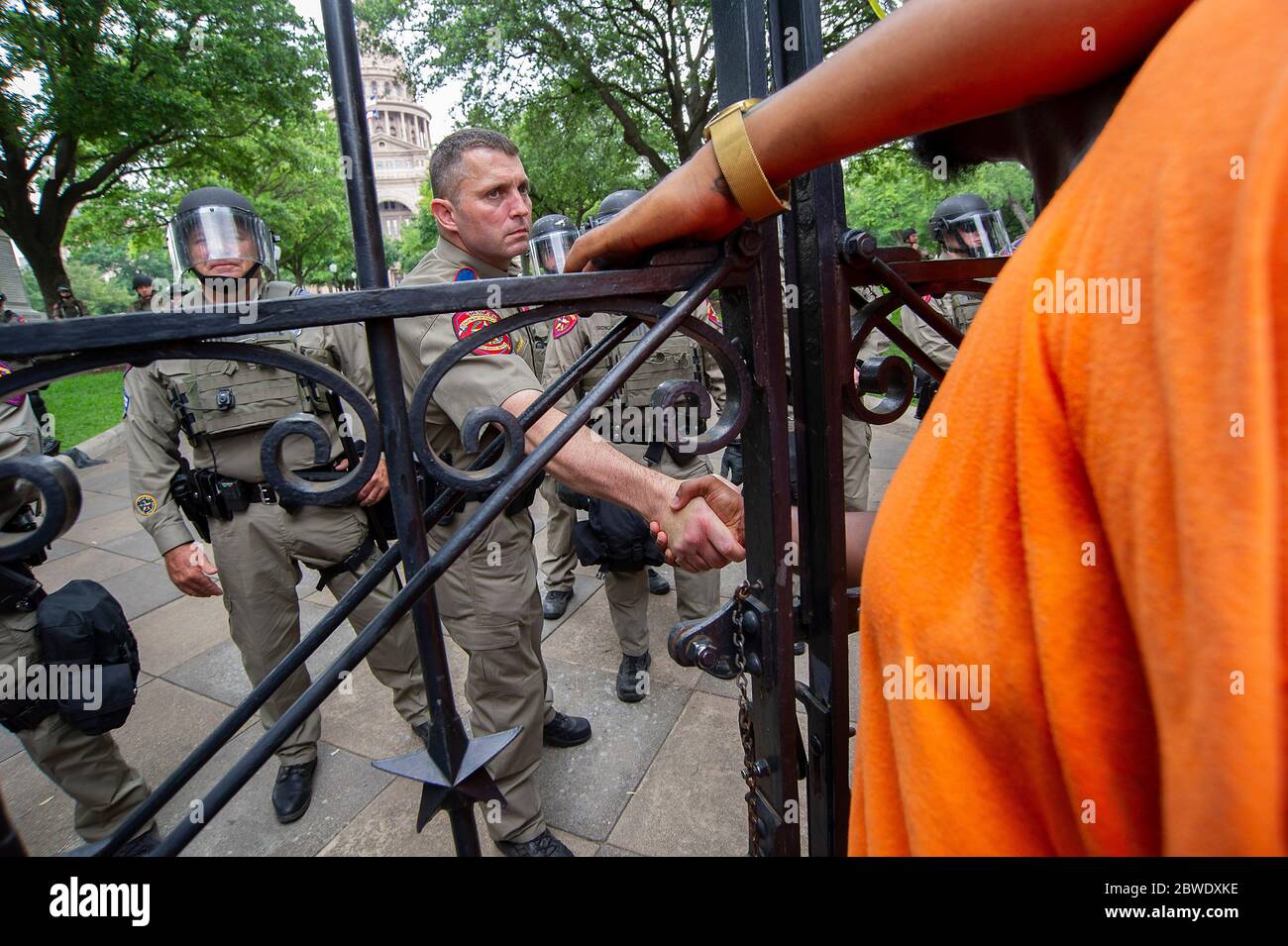 May 31, 2020: A Texas State Police Officer provides a handshake to a ...