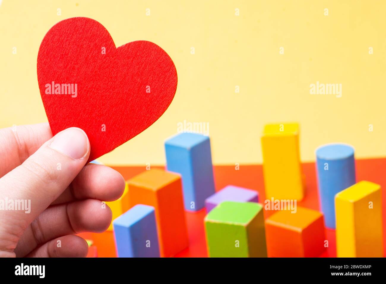 Different color and shape wooden toy building blocks Stock Photo - Alamy
