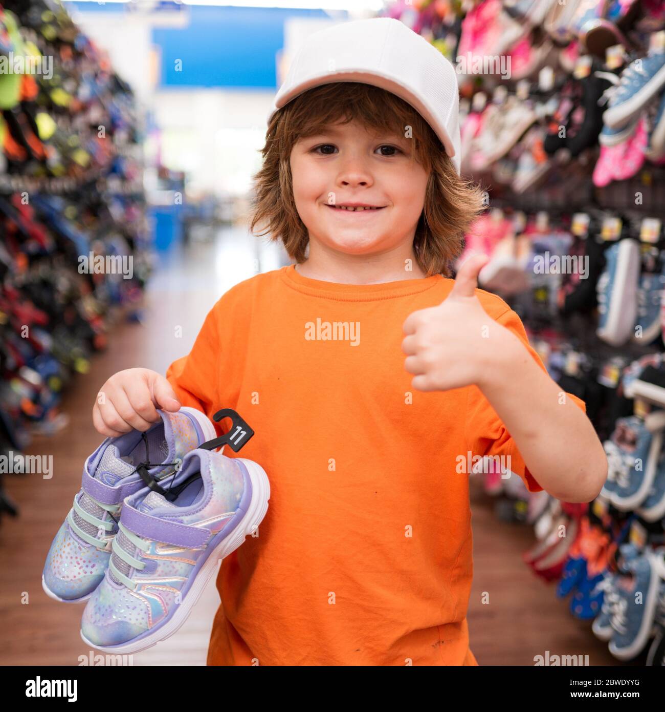 Child buying shoes hi-res stock photography and images - Alamy