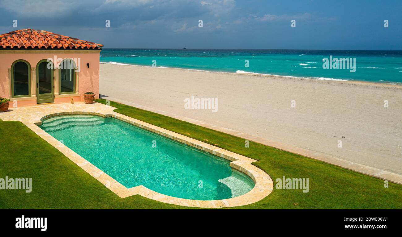 Palm and tropical beach. Terrace of a sea house overlooking the beach ...