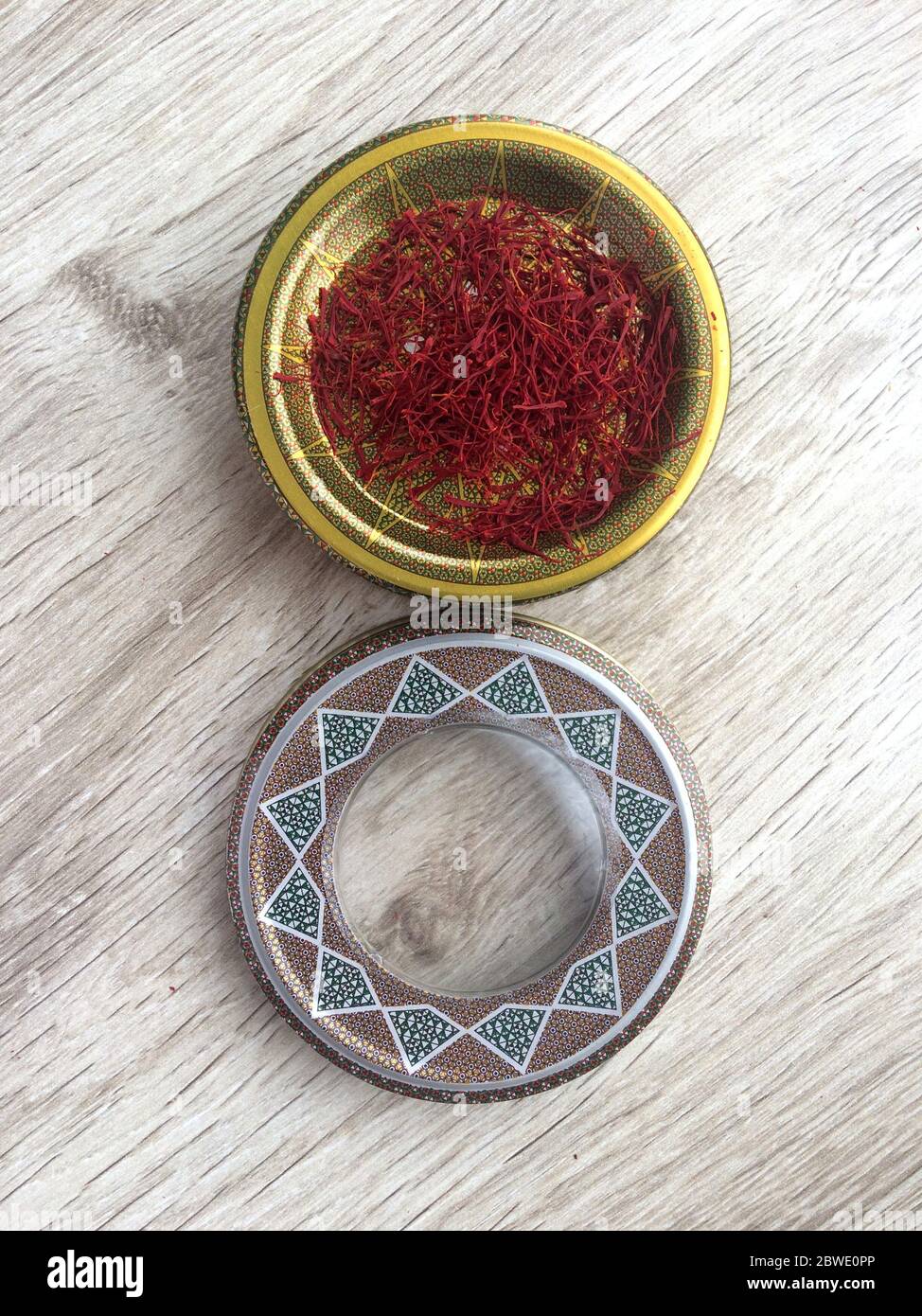 Dried saffron stigmas in beautiful box on wooden background. Iranian ...