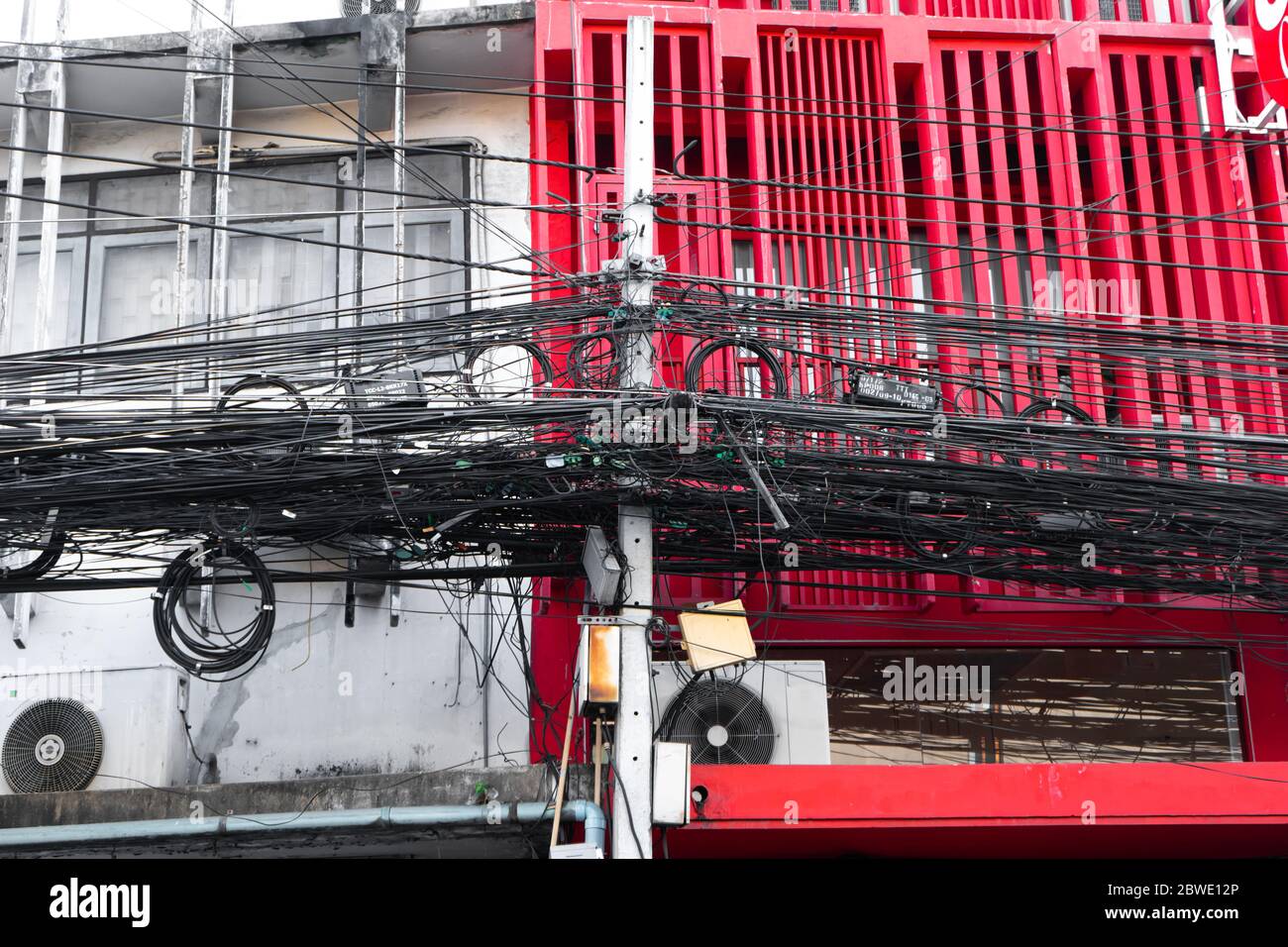 Electrical wiring post in thailand. A huge number of wires on a pole ...