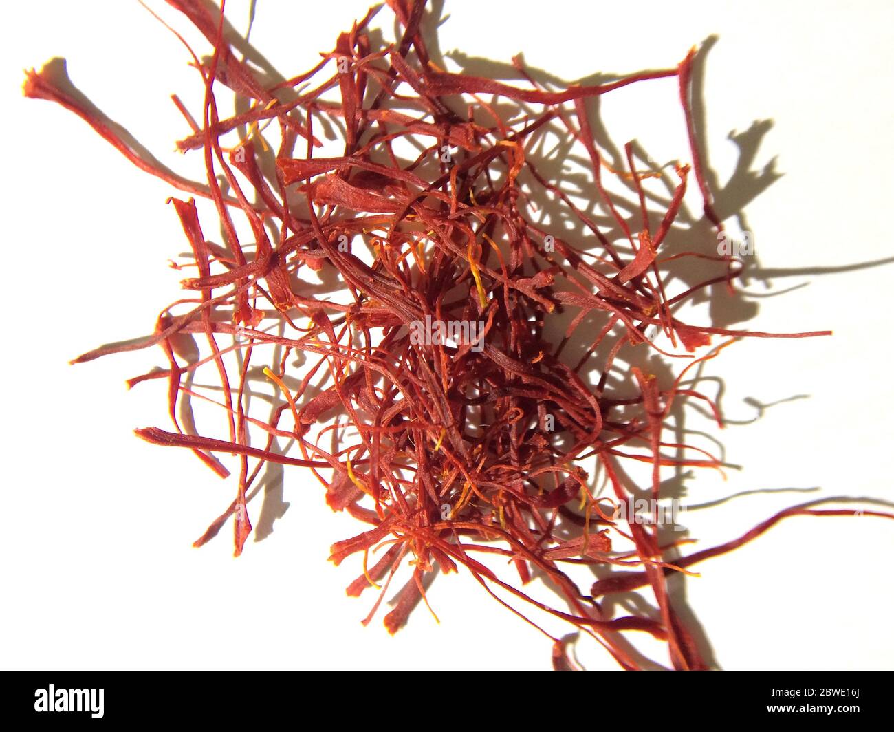 Close up of red saffron stigmas on white background. Top Iranian ...
